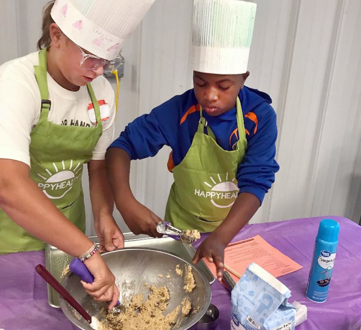 Young people learn cooking skills by doing